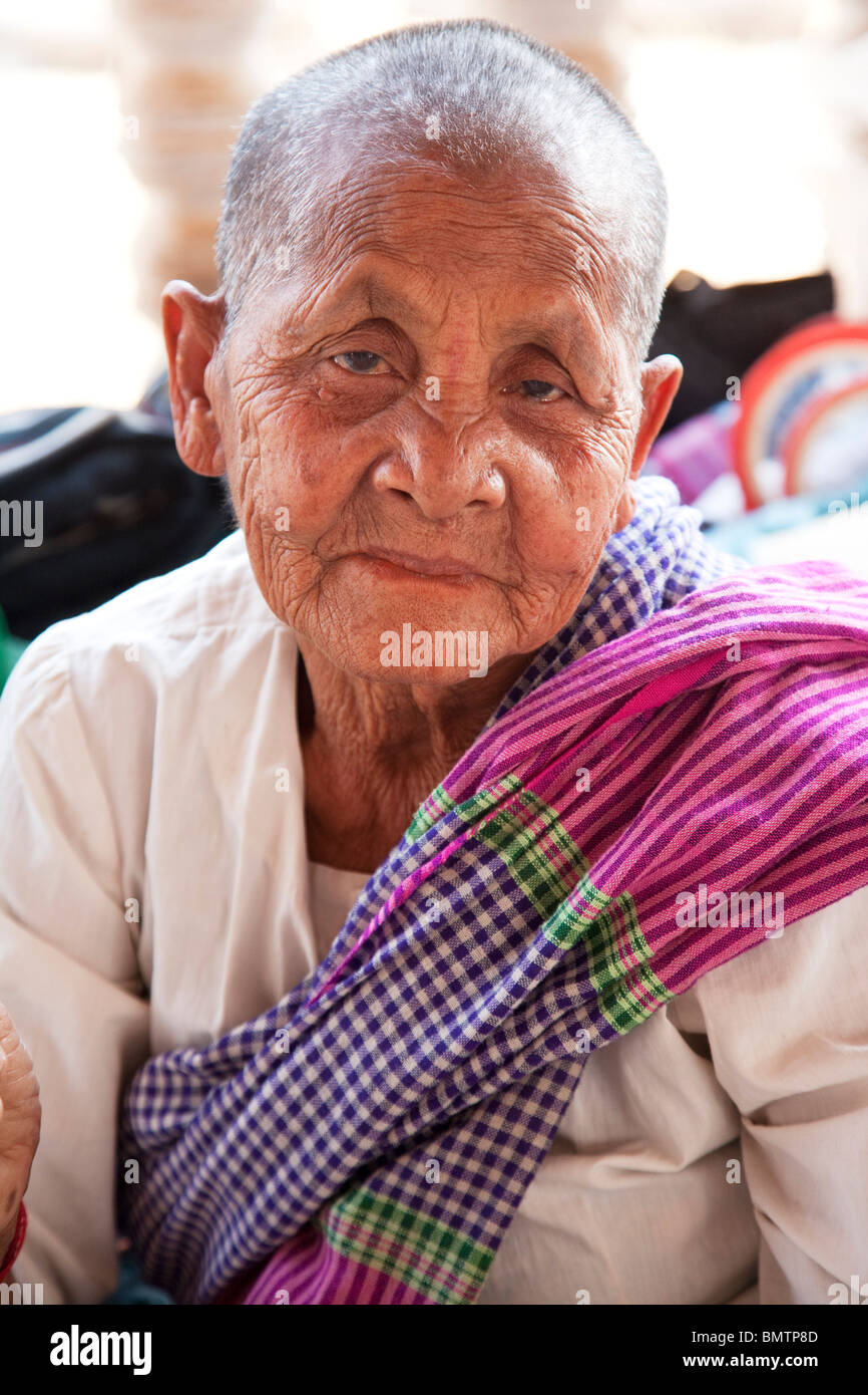 Portrait of elderly female monk in the Banteay Srei Pagoda Angkor Wat ...
