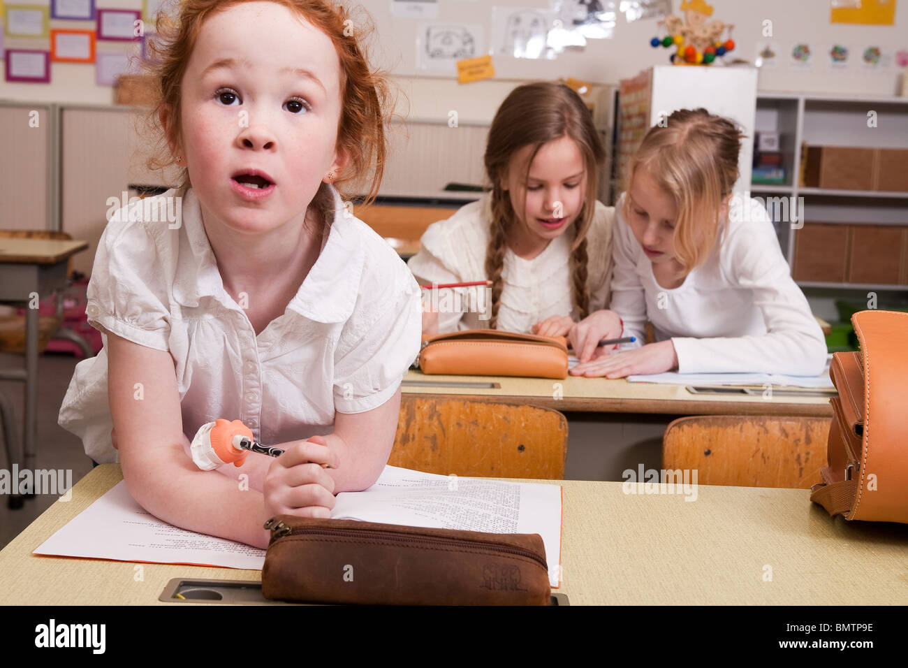 Group of little students with different ages in a classroom Stock Photo ...