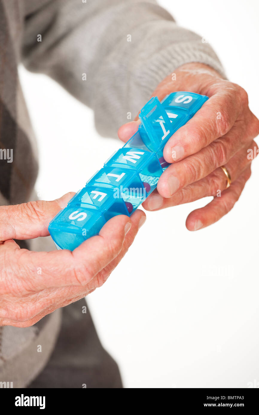 Old man holding pill box hi-res stock photography and images - Alamy