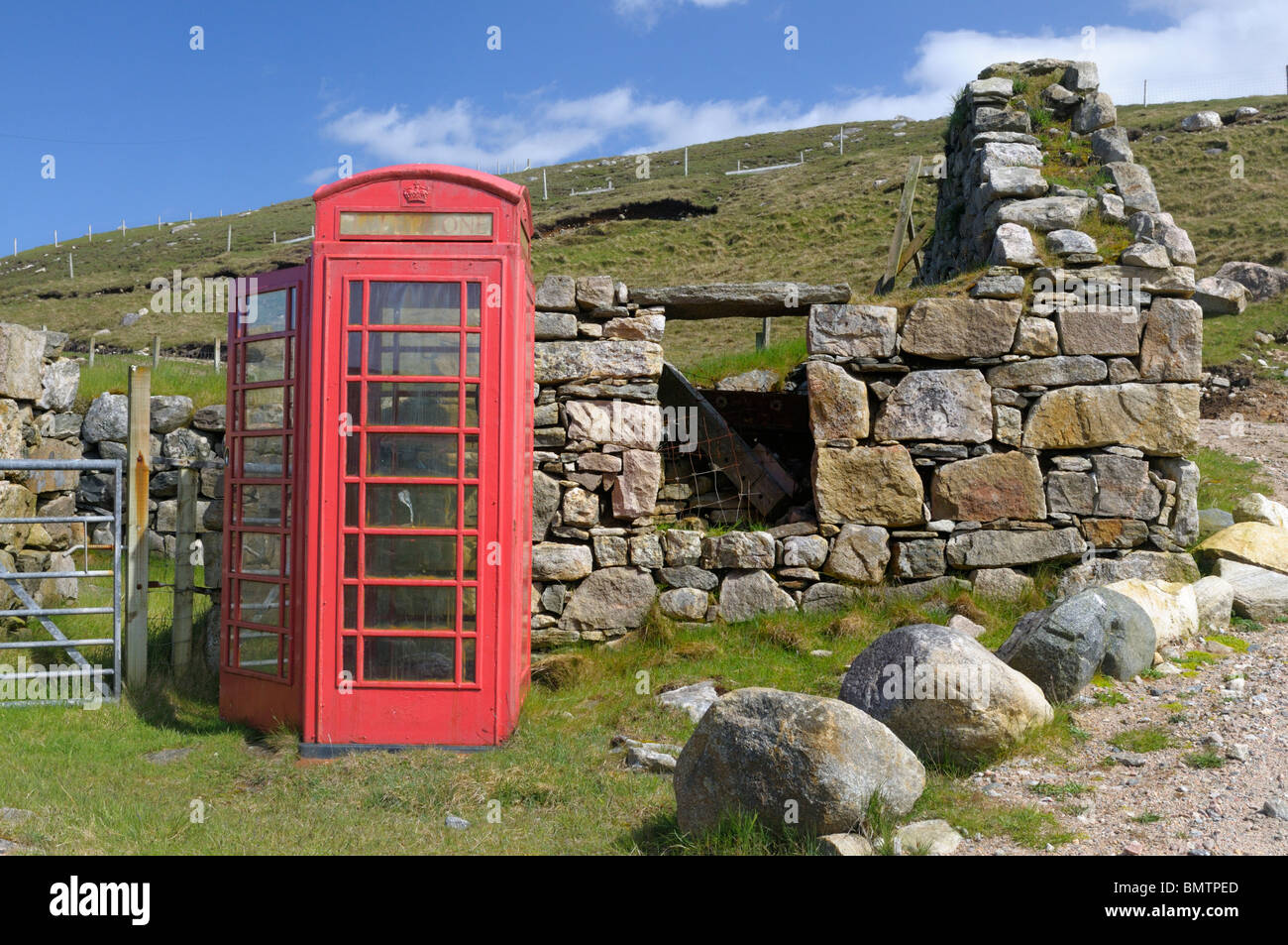 Old style red UK phone box next to a derelict croft house Stock Photo ...