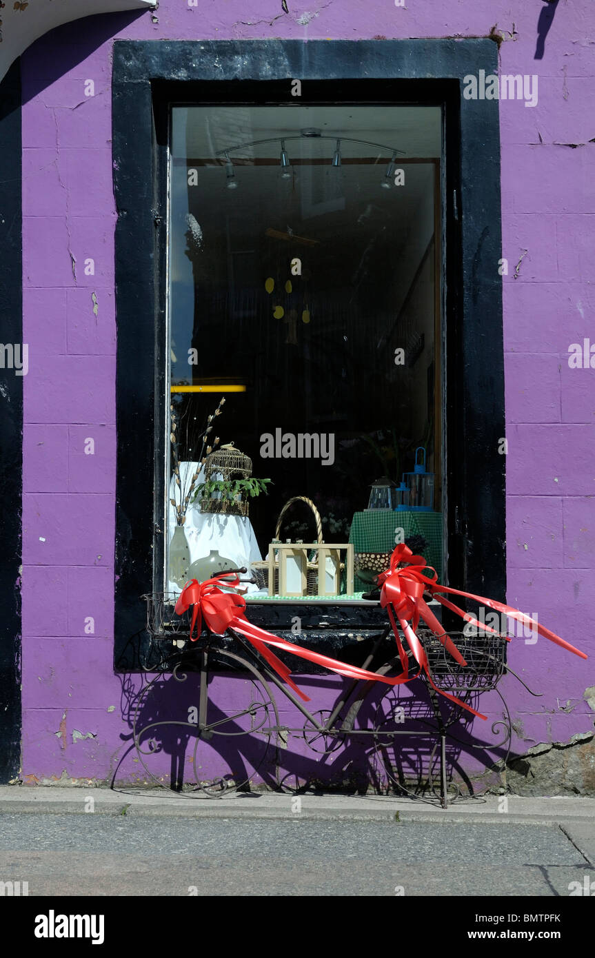 An old ornamental bicycle outside a shop window Stock Photo - Alamy