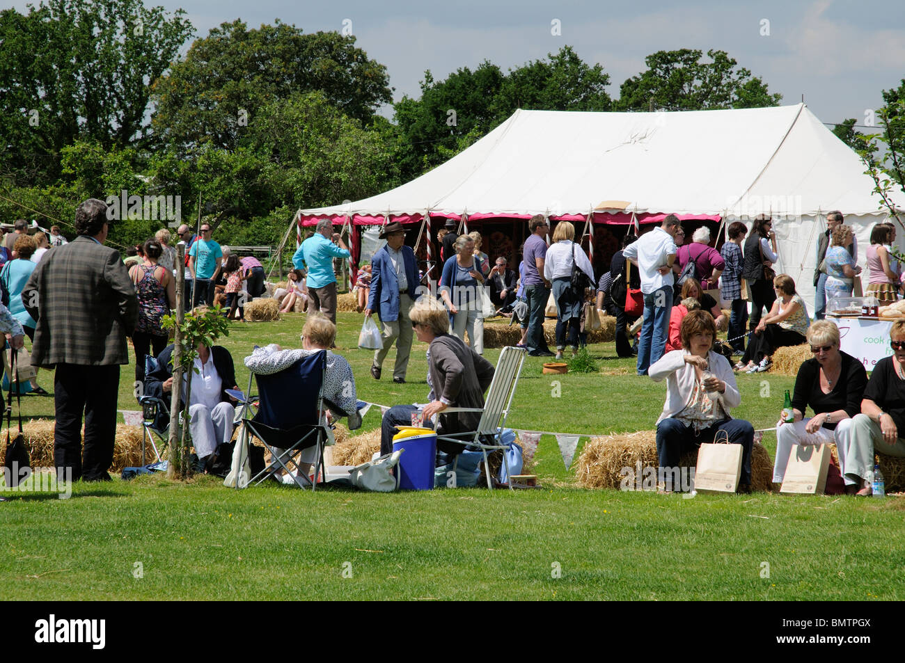 Visitors at a summer fair rural England Stock Photo - Alamy