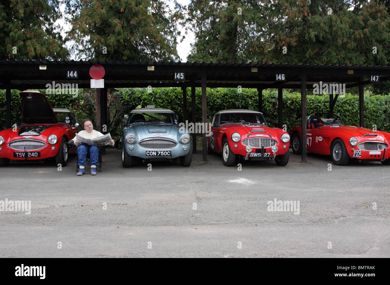 Racing driver relaxing reading newspaper hi-res stock photography and ...