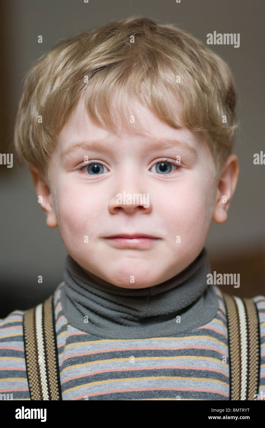 Cute little boy with blue eyes looking forward Stock Photo - Alamy