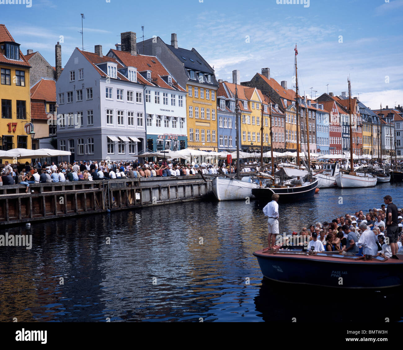 Colourful waterside buildings and old sailing ships, Nyhavn, Copenhagen ...