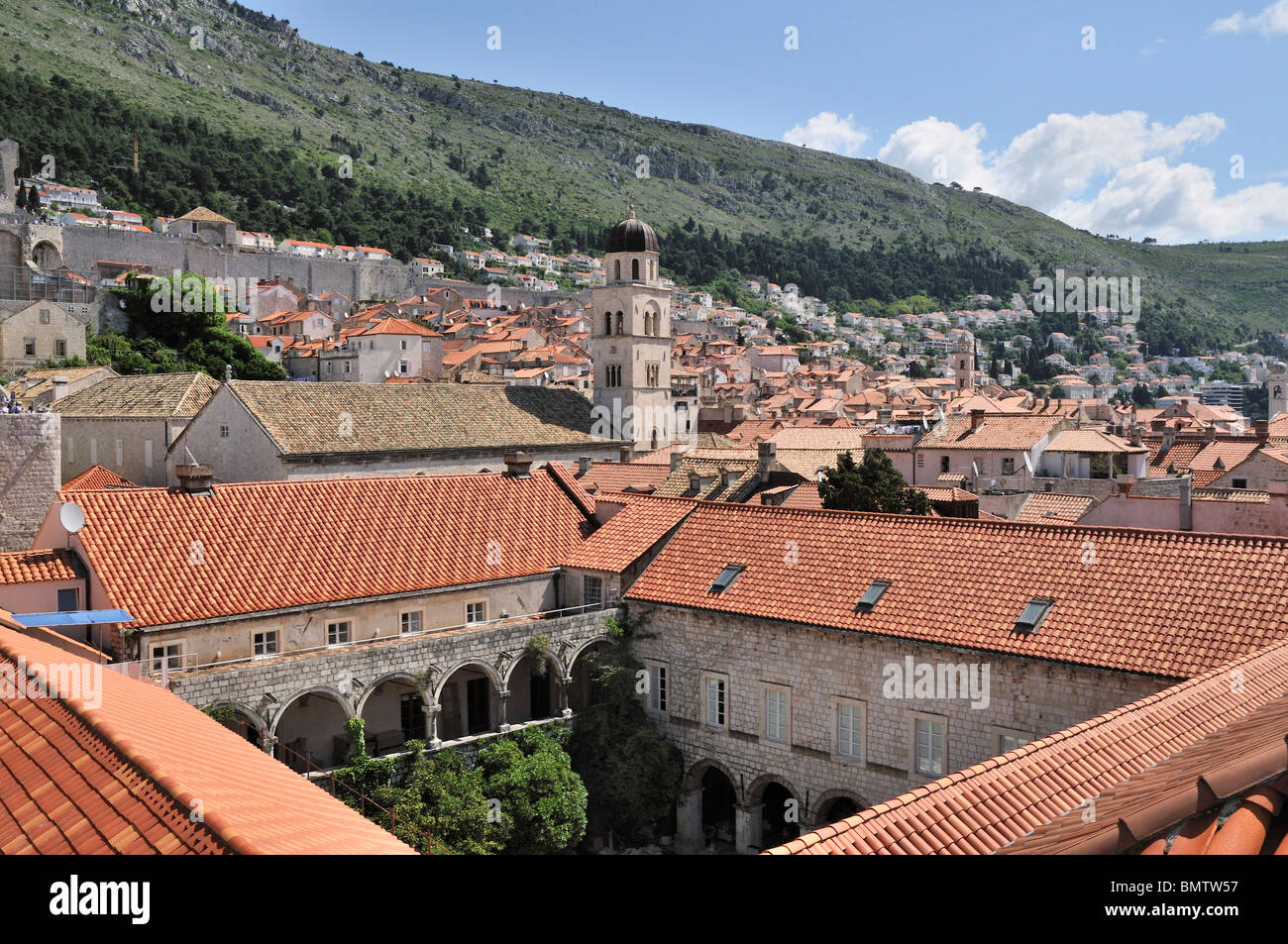 The bell tower of St Saviour Church looks down into the courtyard of ...