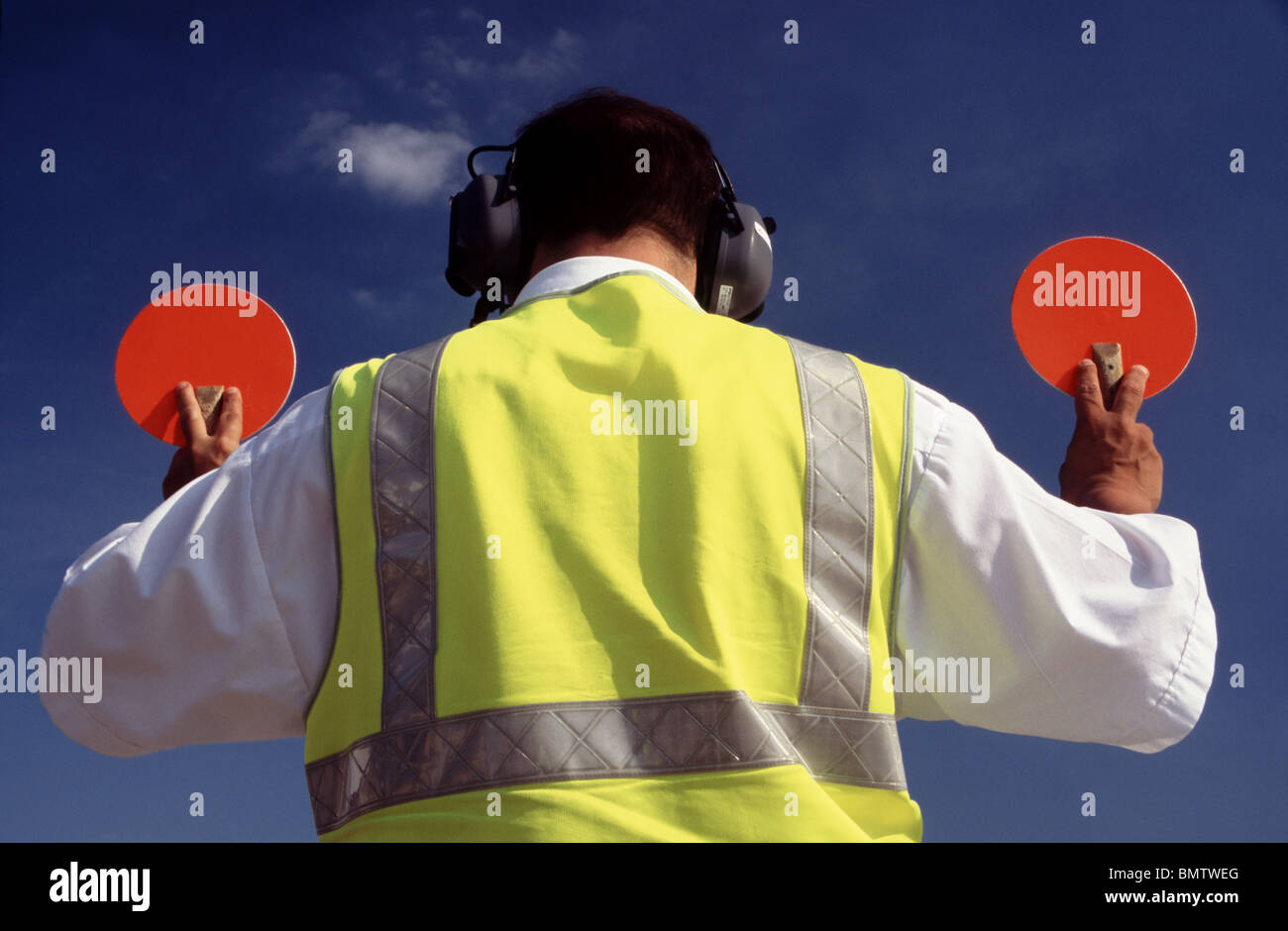 Airport Marshaller marshalling marshall aviation Stock Photo - Alamy