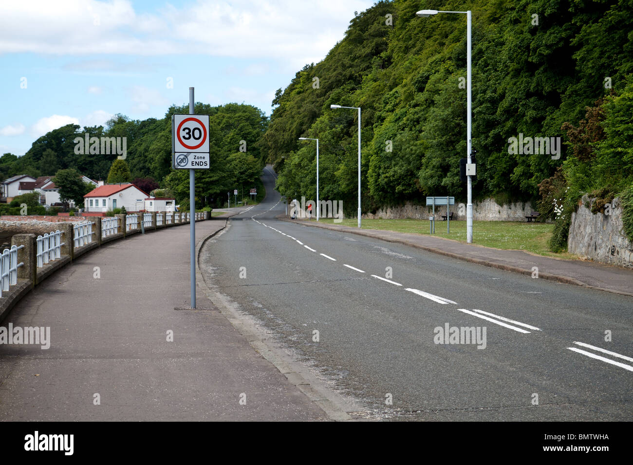 Village road showing 30mph speed limit sign Stock Photo - Alamy