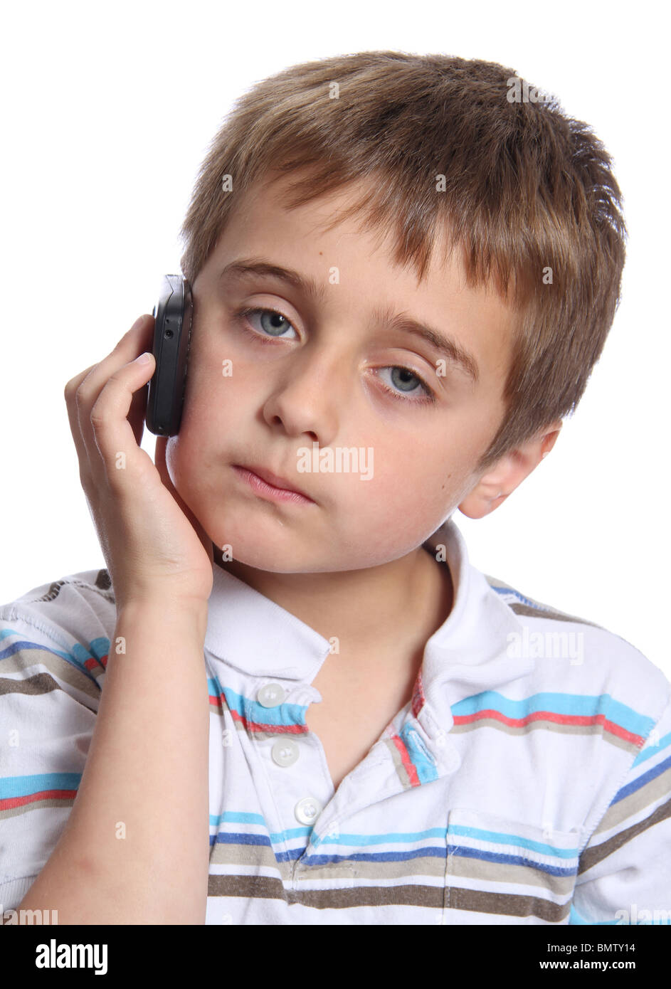 Small boy using a telephone talking to his friend Stock Photo - Alamy
