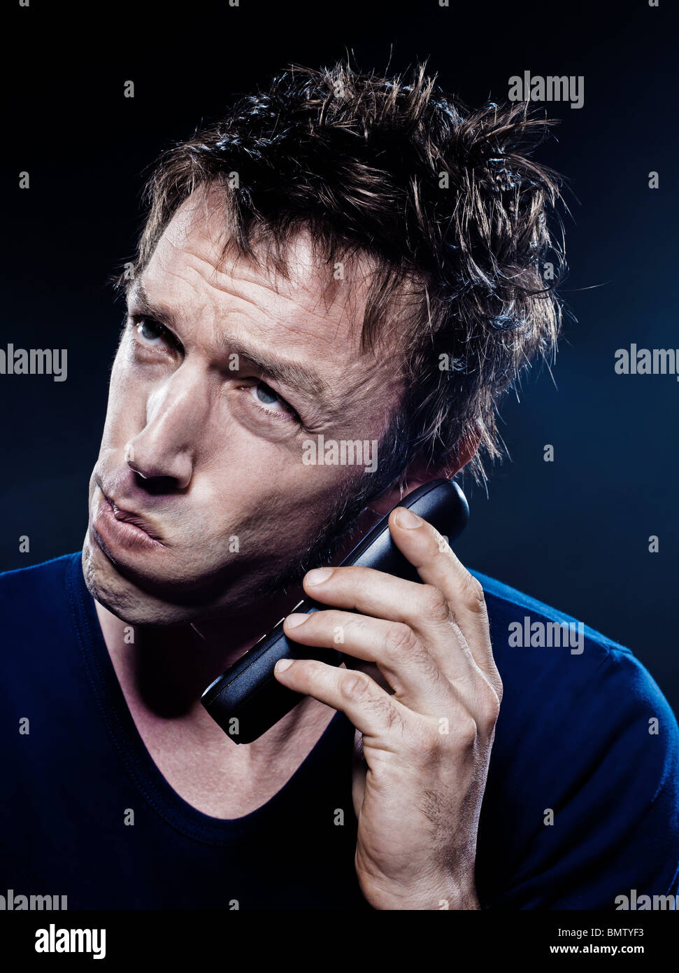 studio portrait on black background of a funny expressive caucasian man ...