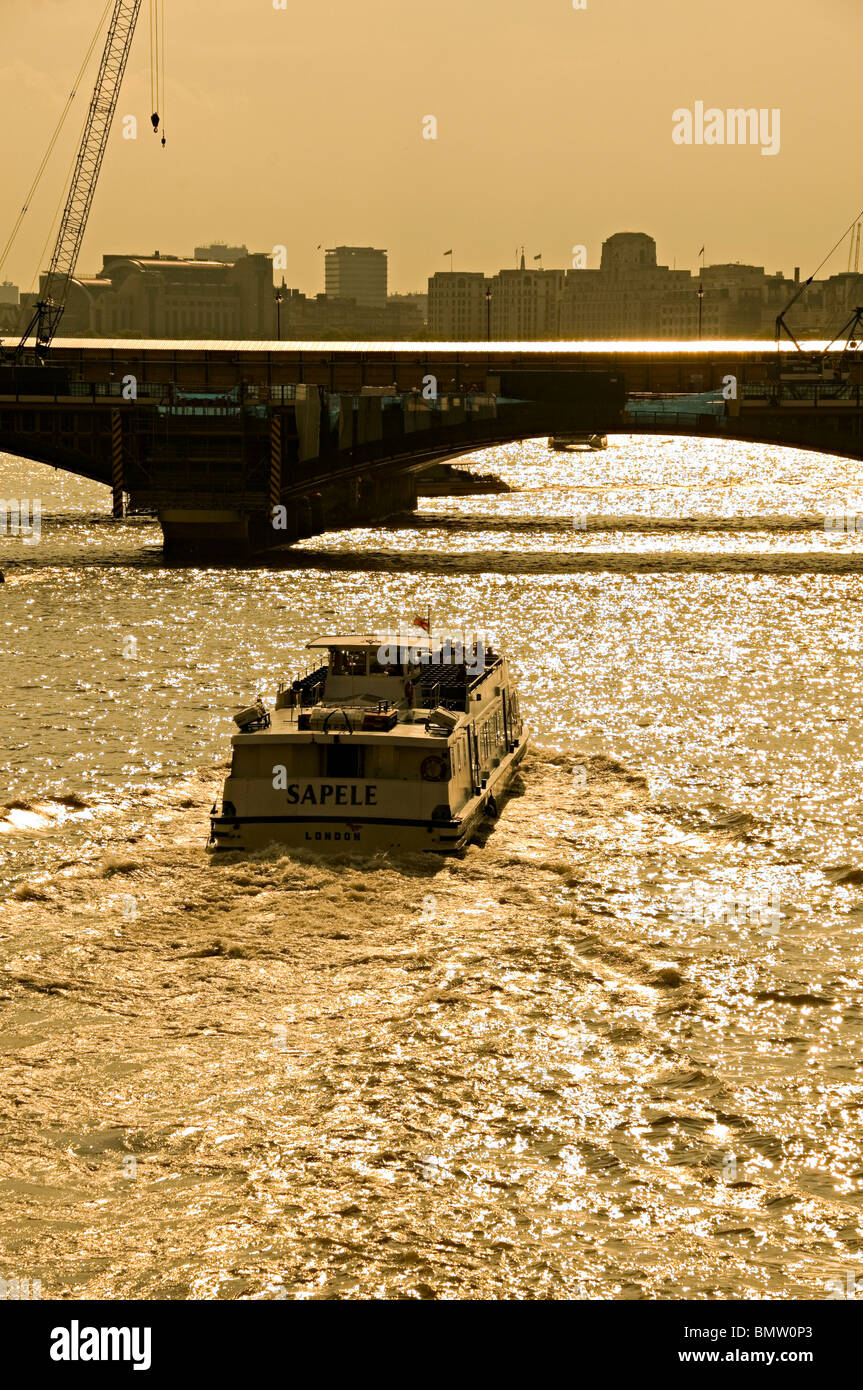 a London tourist boat on the Thames at sunset Stock Photo - Alamy