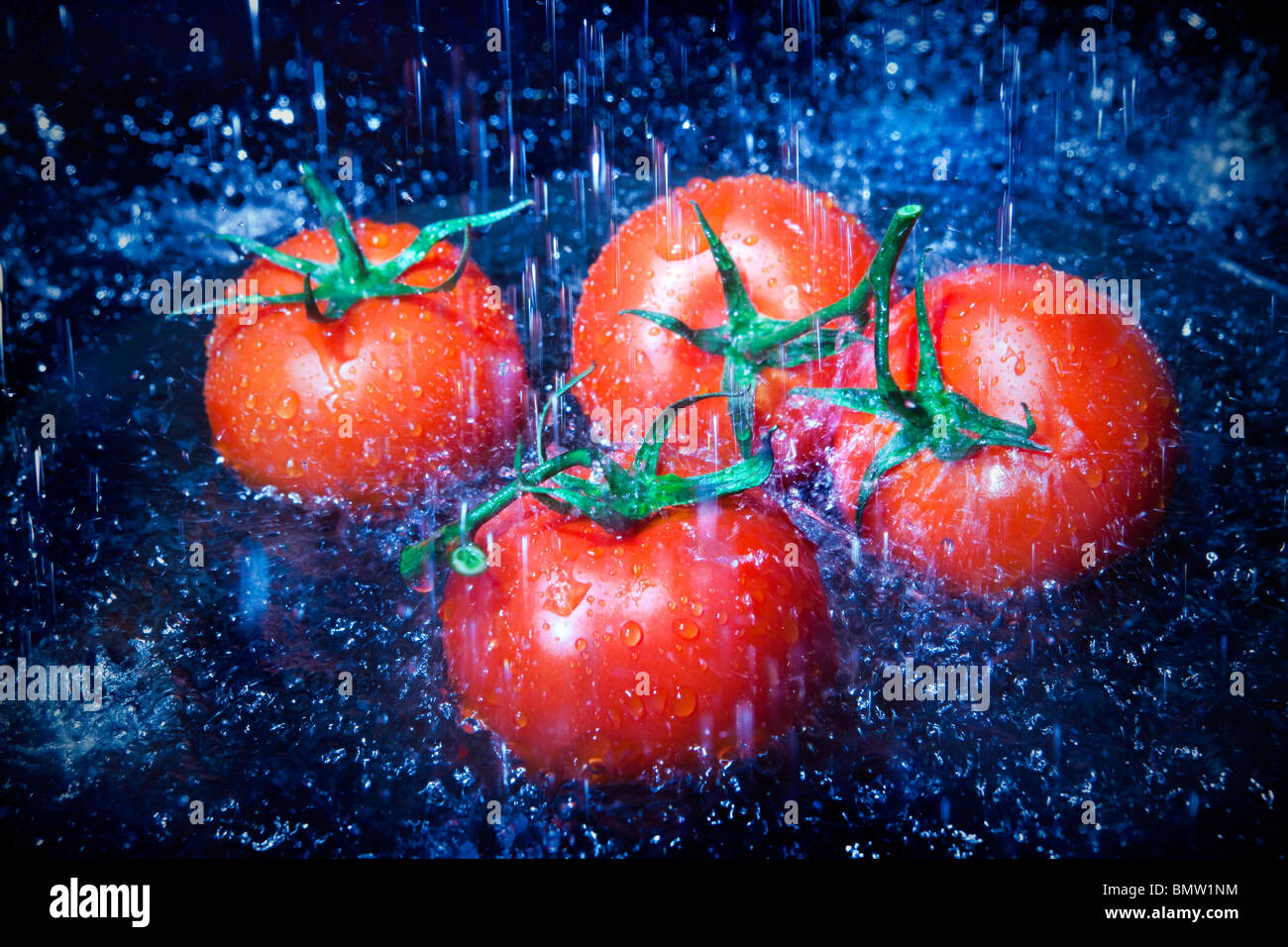 Red ripe tomatoes water spray hi-res stock photography and images - Alamy