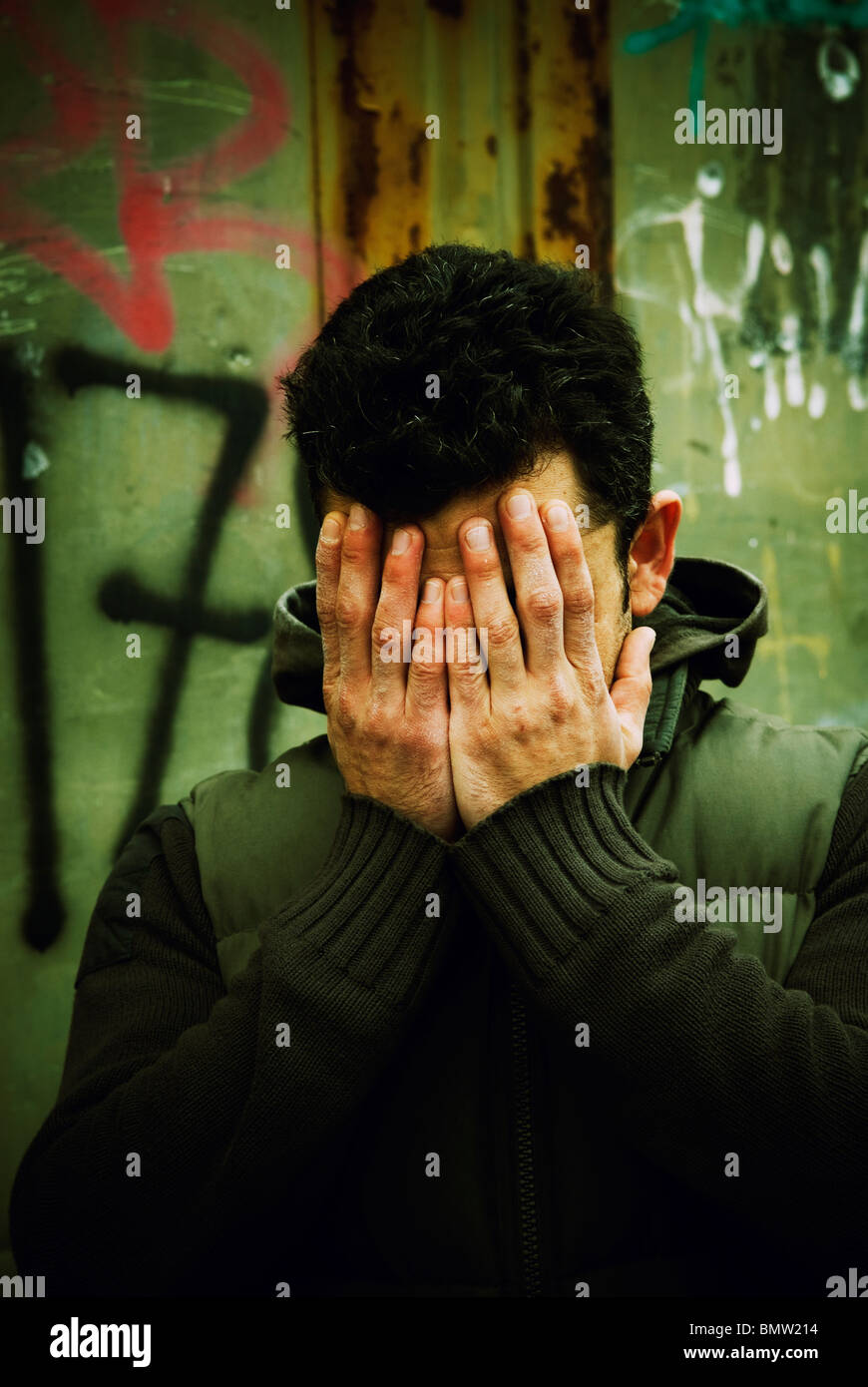 Depressed man hands over face hi-res stock photography and images - Alamy