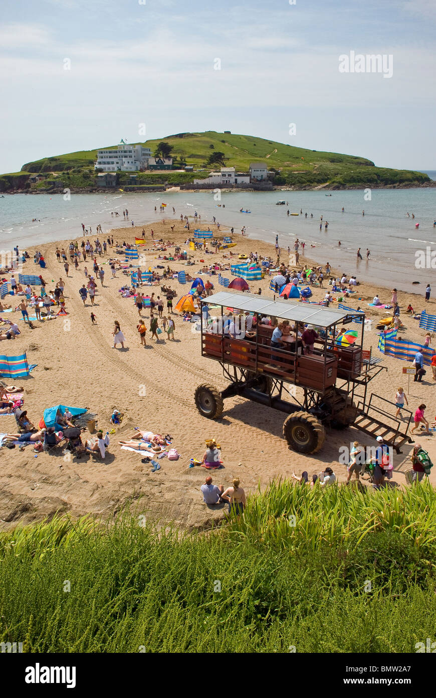 Holiday makers and the Burgh Island sea tractor on the beach at Bigbury ...