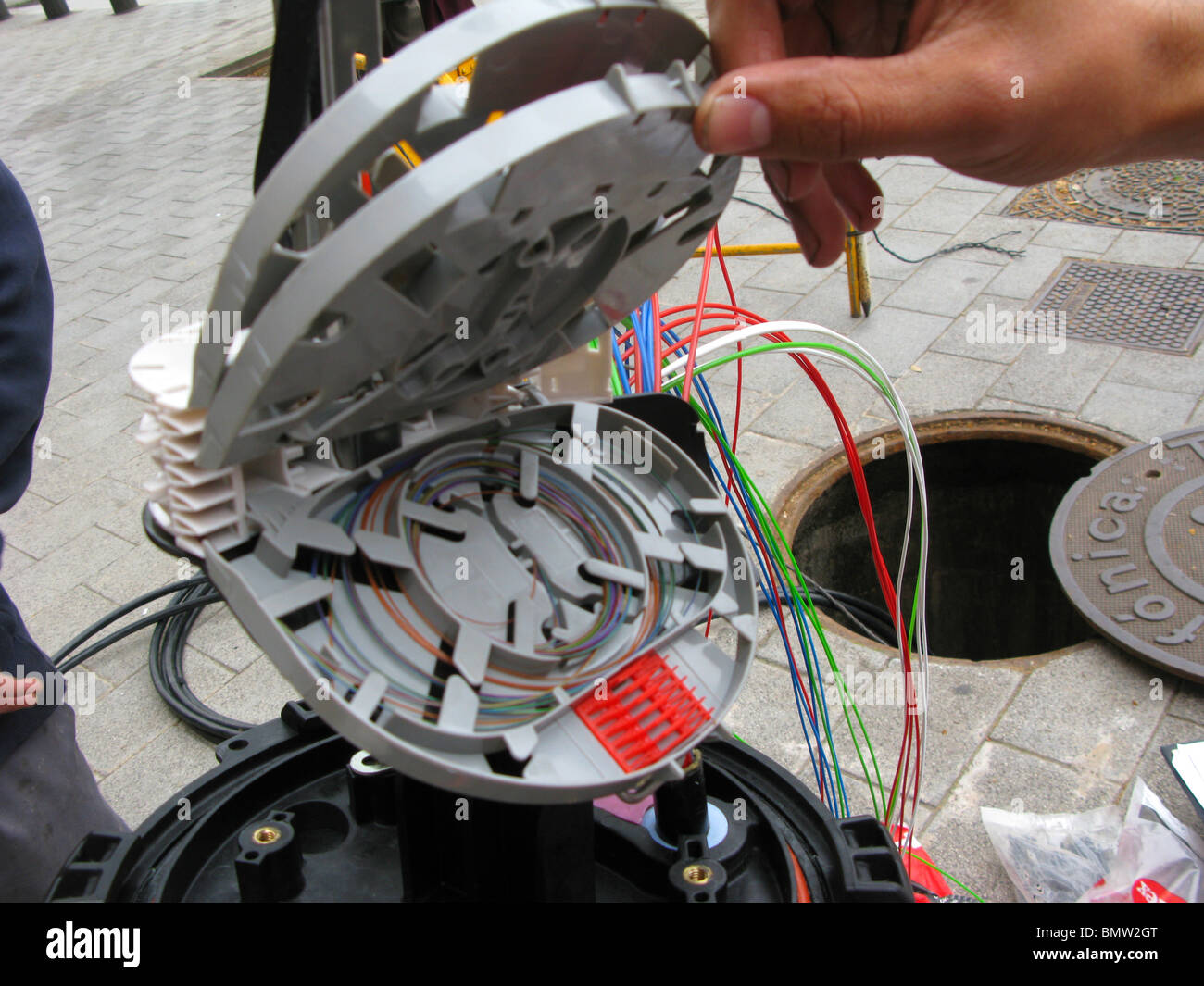 fiber optics install road Stock Photo - Alamy