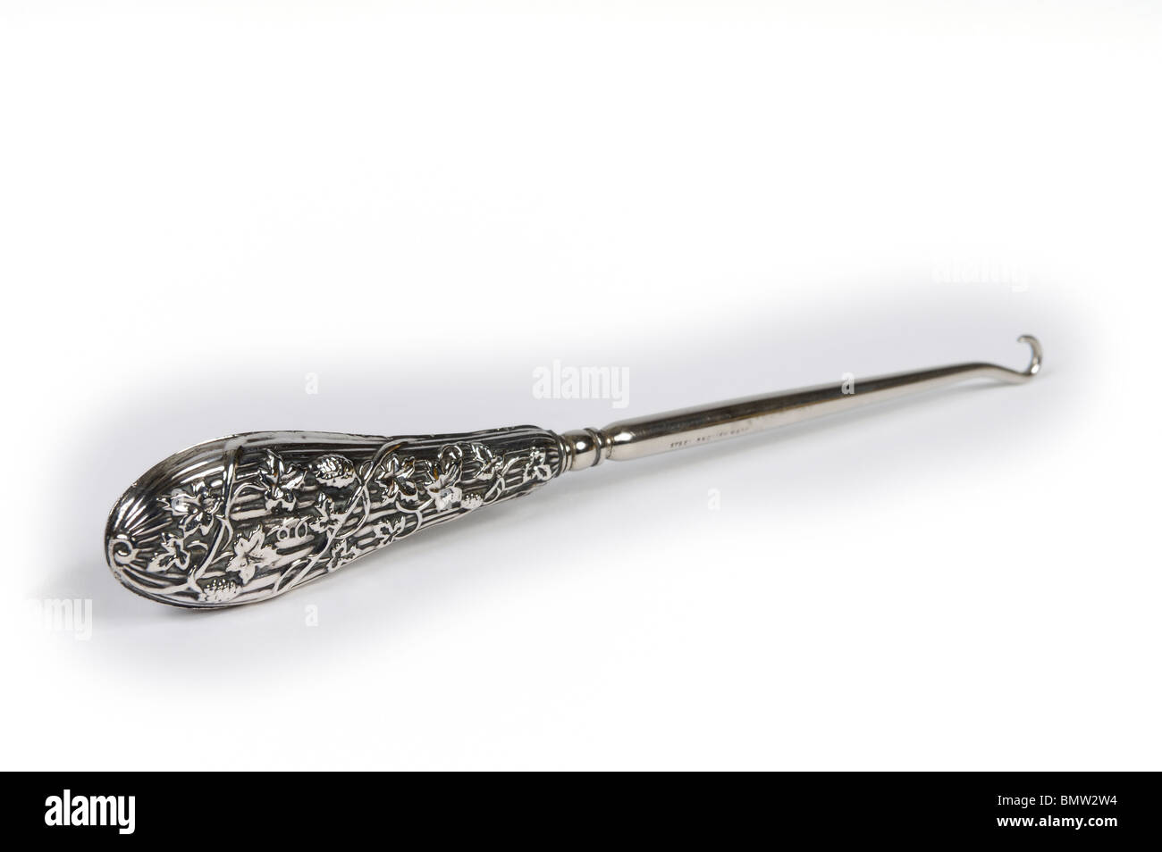 An English button hook with hallmarked Sterling silver handle and steel ...