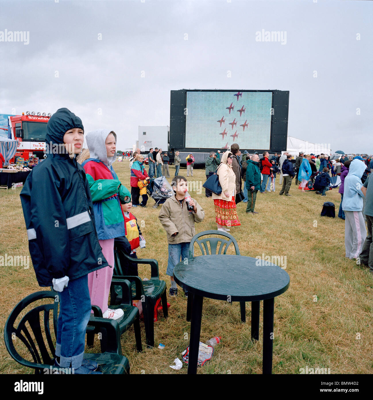 Young spectators watch display by the 'Red Arrows', Britain's Royal Air ...