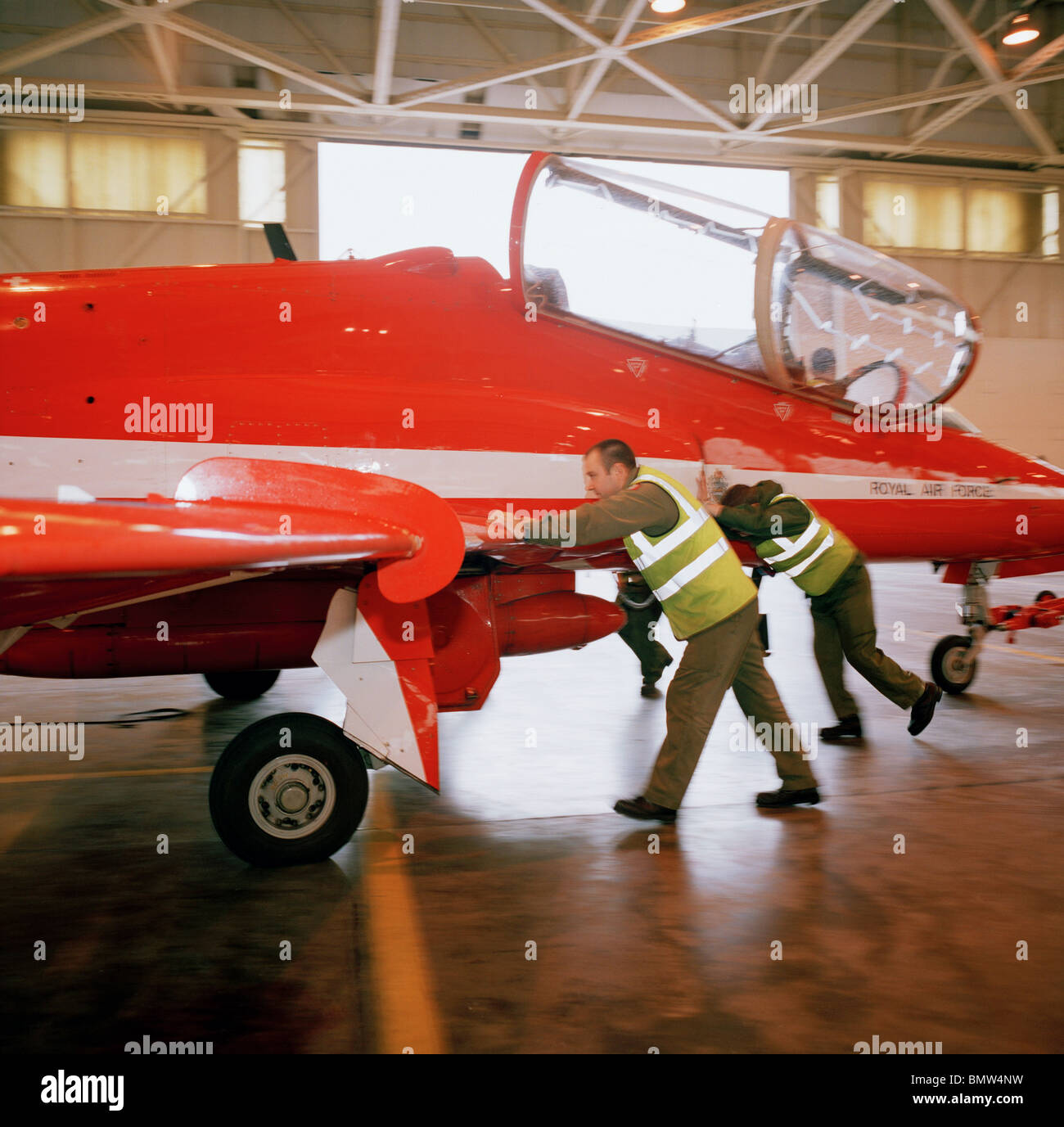 Pushing plane into hangar hi-res stock photography and images - Alamy