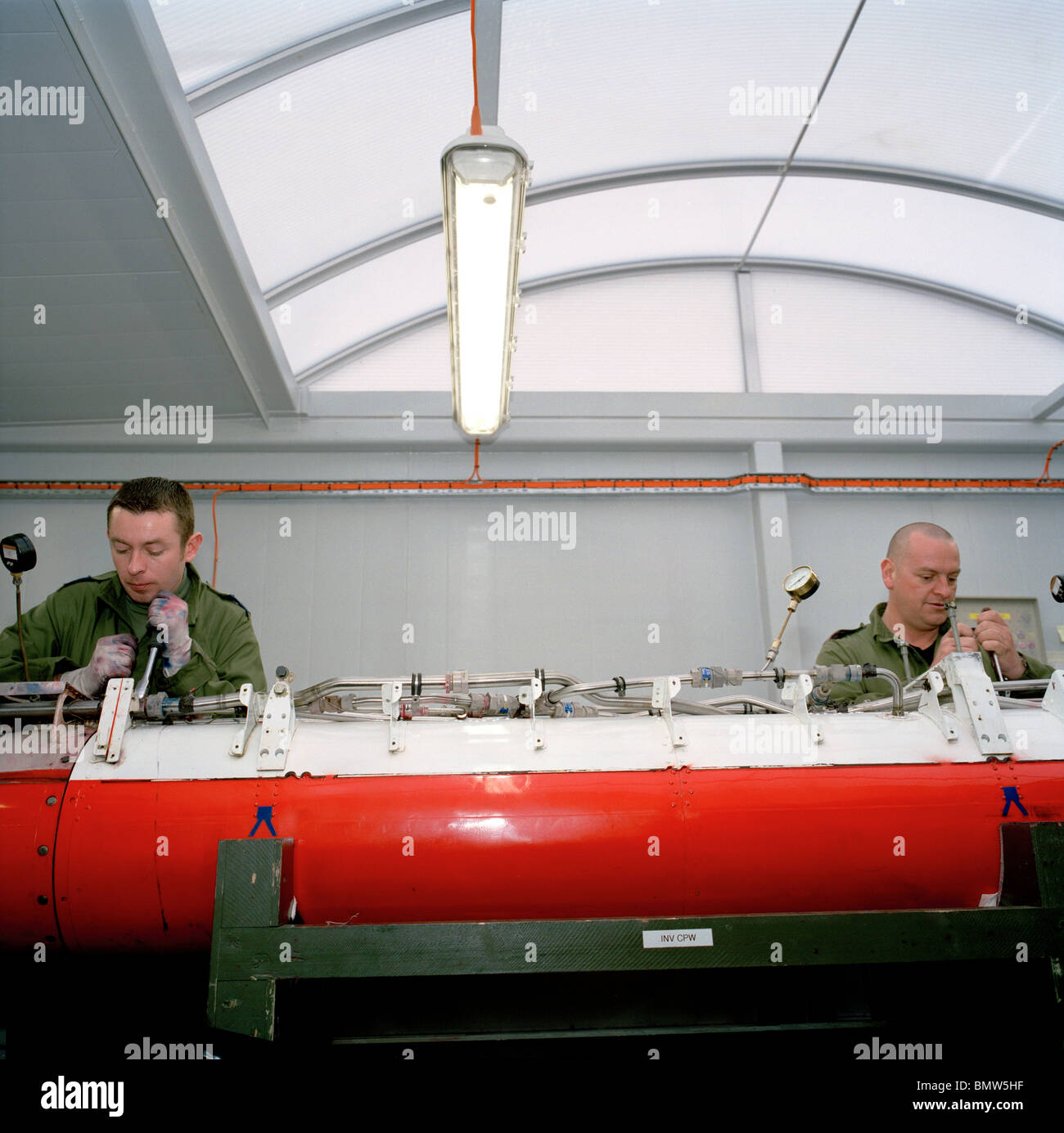 Propulsion engine specialist inspects internal Hawk of the 'Red Arrows ...