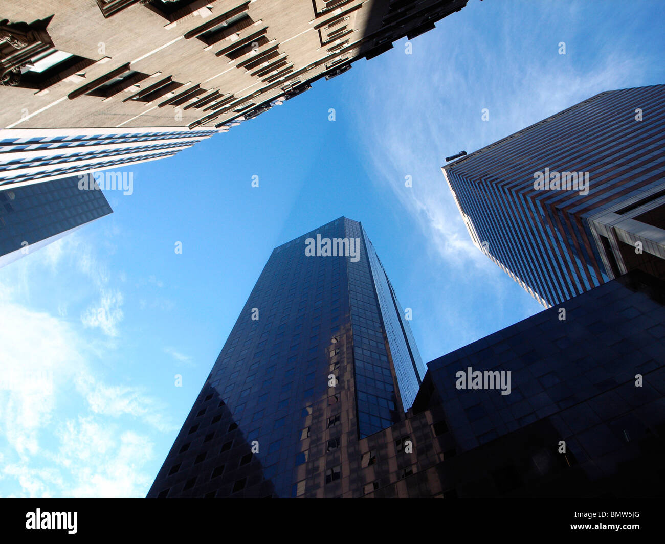 Looking up New York Skyscrapers from ground level in New York City, USA ...