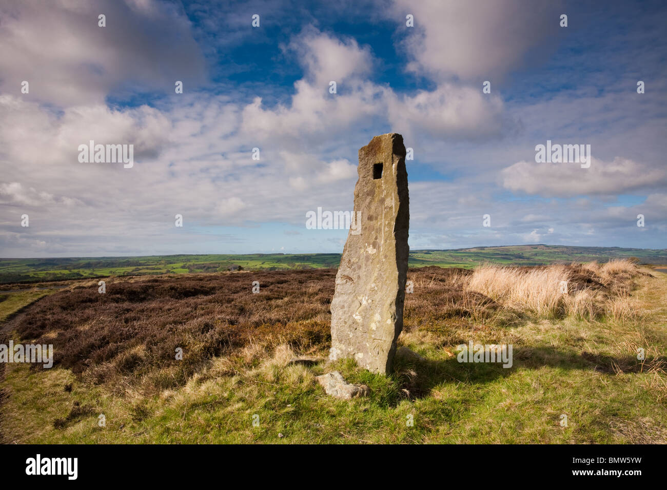 Late evening light glancing across a standing stone on Egton High Moor ...