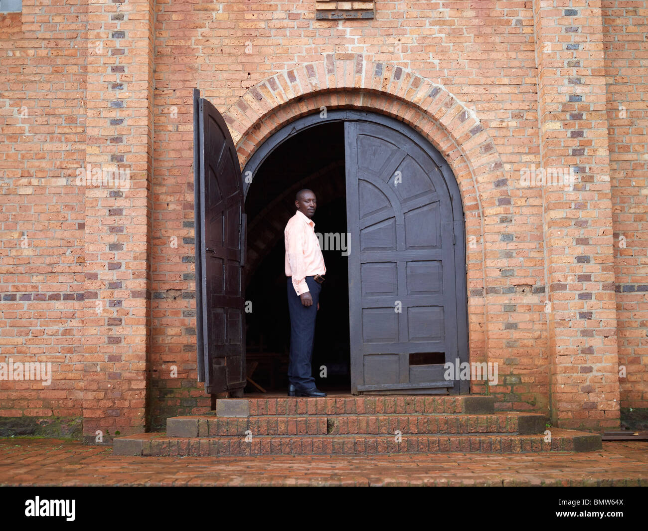African man standing in doorway, Rwanda, post genocide Stock Photo - Alamy