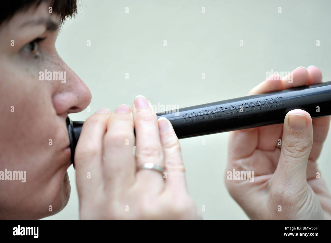 woman blowing vuvuzela Stock Photo - Alamy