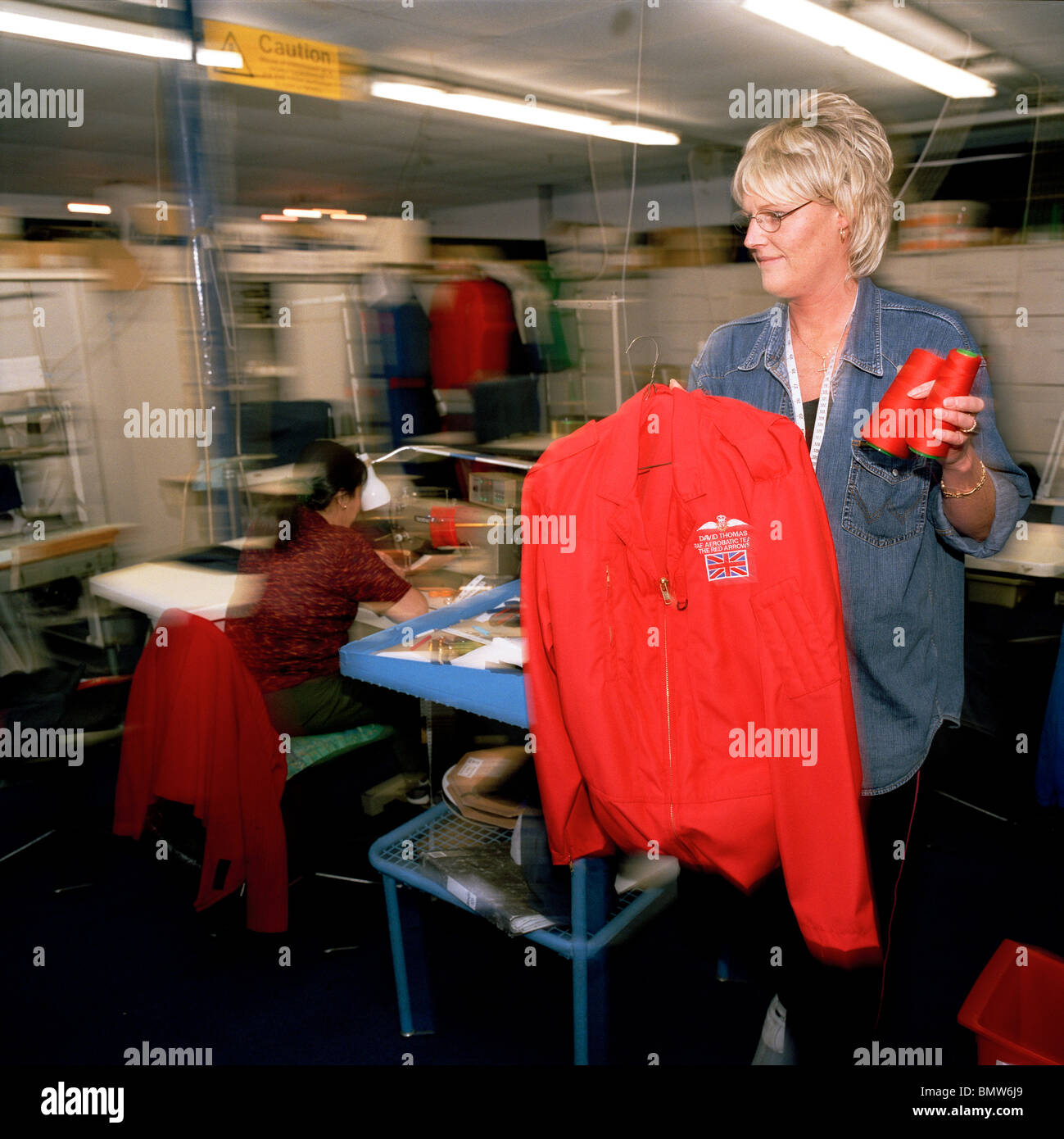 Senior Machinist Supervisor finishes one of 3 red flying suits of ...