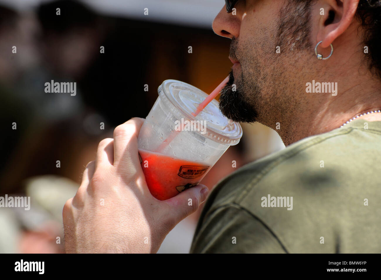 Man drinking beverage plastic container straw thirst thirsty drink hi ...