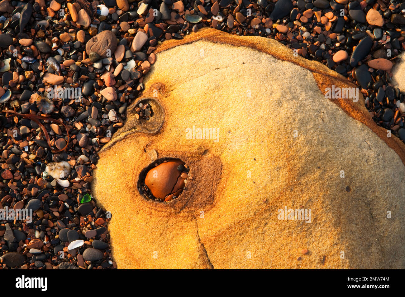 Rocks and Pebbles in early morning light at Saltwick Bay in North ...