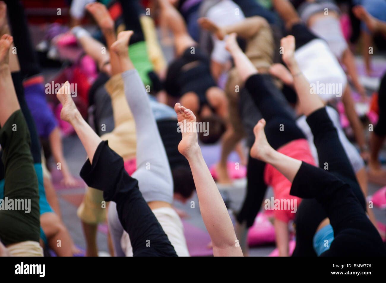 Yoga practitioners in Times Square in NY participate in one of the free ...