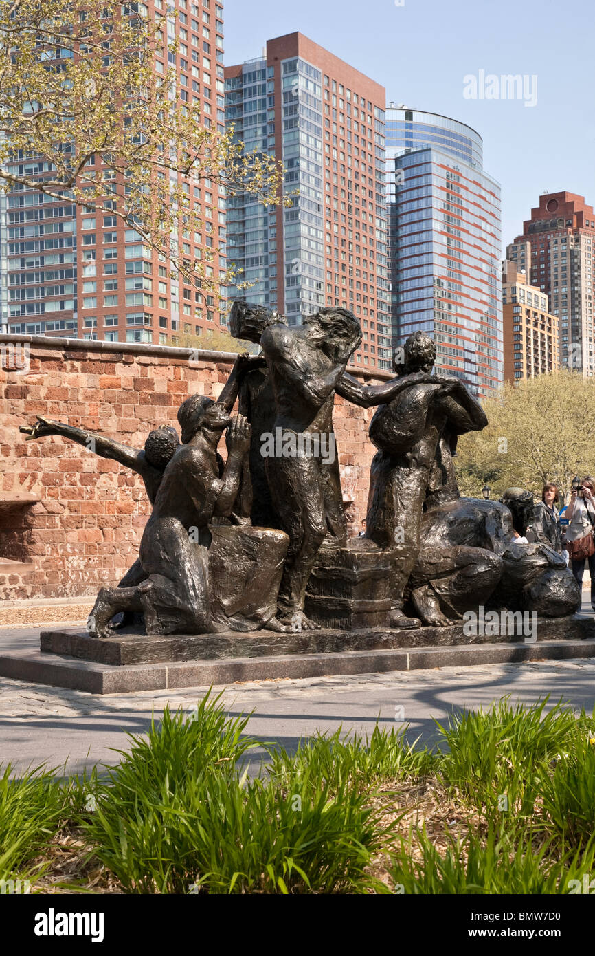 The Immigrants Statue, Battery Park, NYC Stock Photo - Alamy