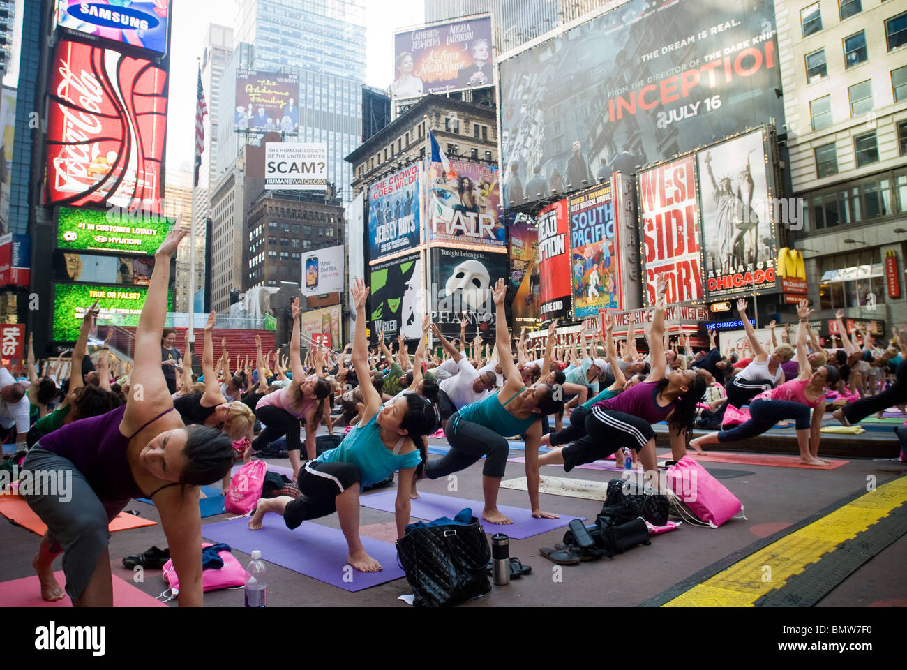 Yoga practitioners in Times Square in NY participate in one of the free ...