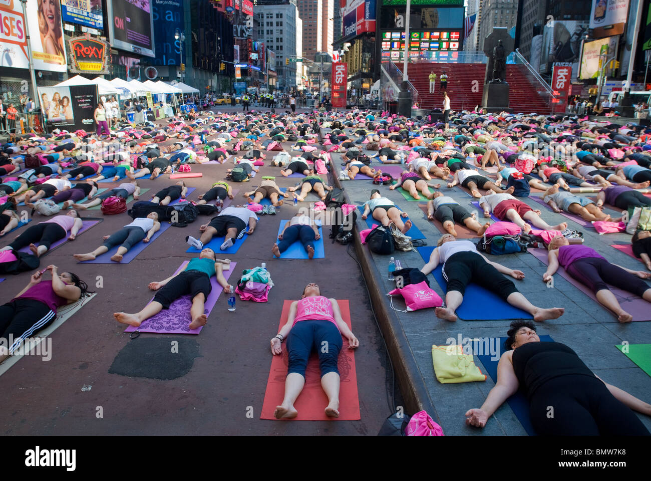 Yoga practitioners in Times Square in NY participate in one of the free ...