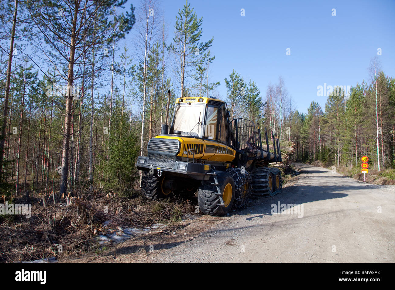 Yellow Ponsse Elk forest harvester at roadside , Finland Stock Photo ...