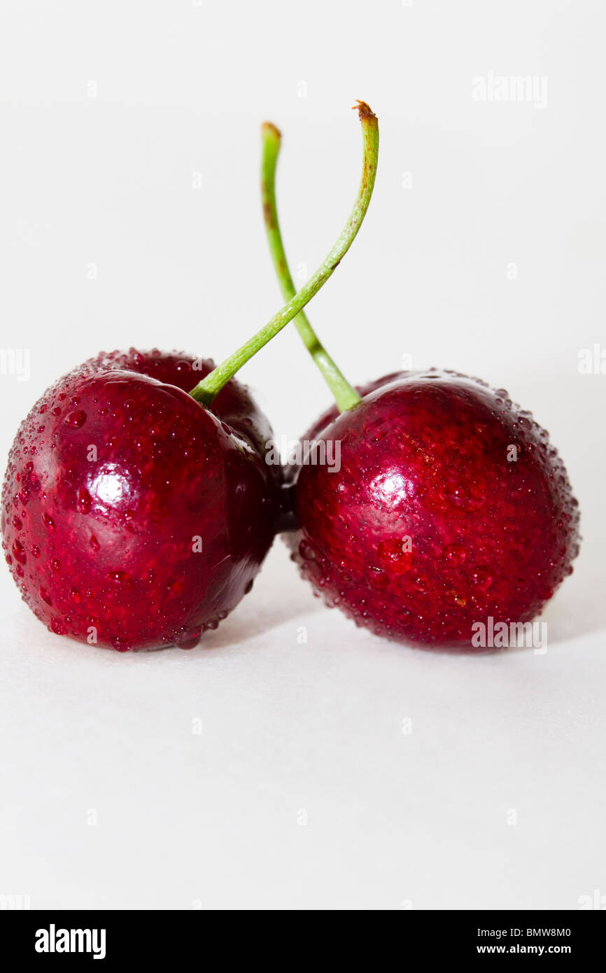 Red sweet cherries isolated on white background Stock Photo - Alamy