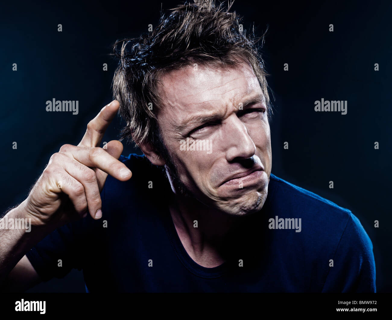 studio portrait on black background of a funny expressive caucasian man ...