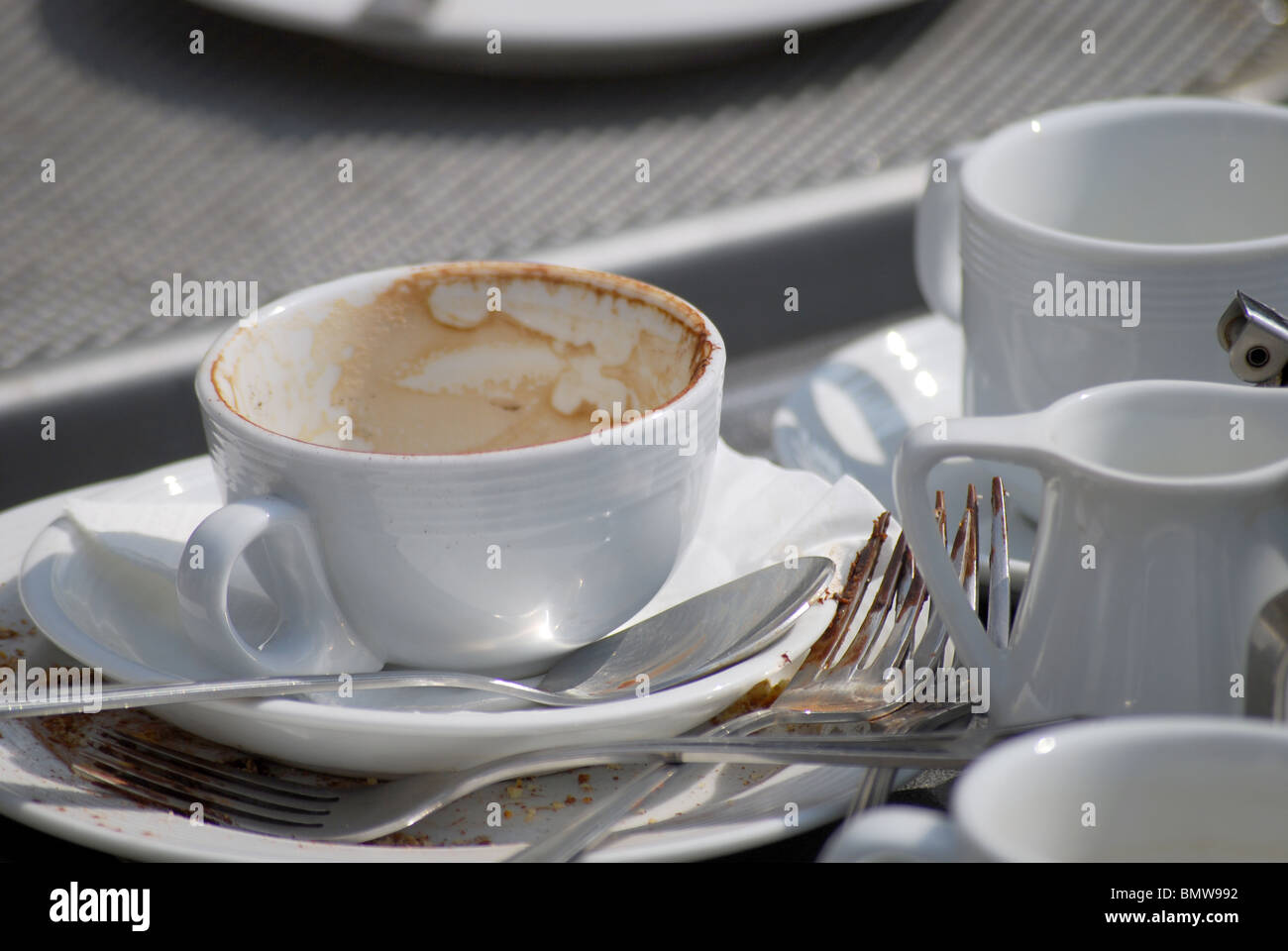Coffee cups cafe cups saucers milk froth relaxed finished messy Stock ...