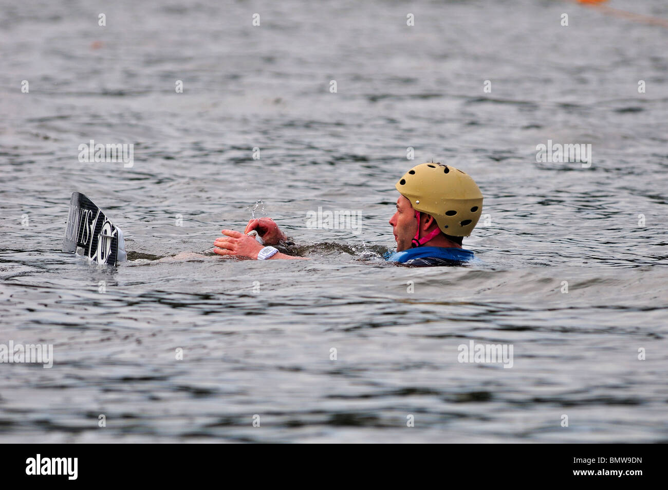Man falls in water whilst wake boarding Stock Photo - Alamy