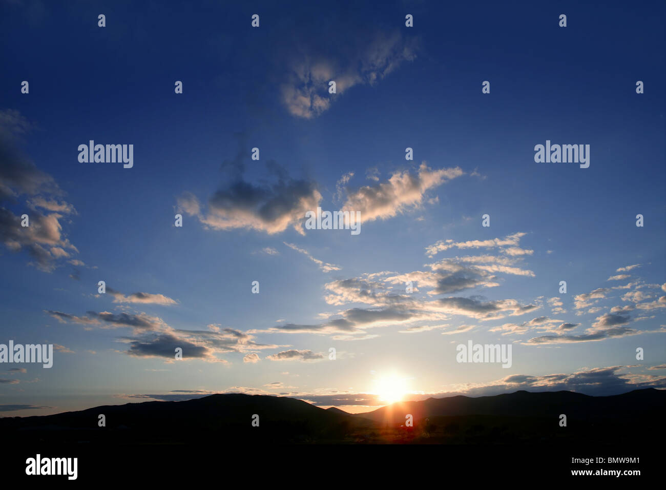 blue red sunset sky background stormy clouds Stock Photo - Alamy