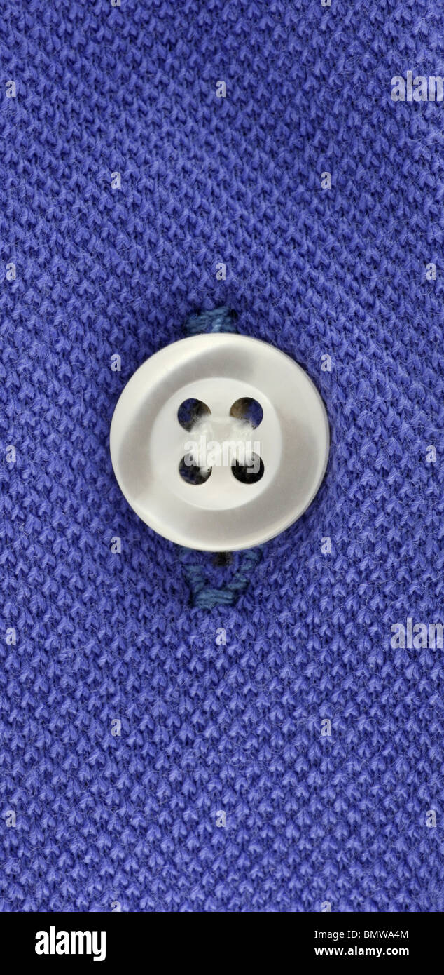 Button on cloth Stock Photo - Alamy