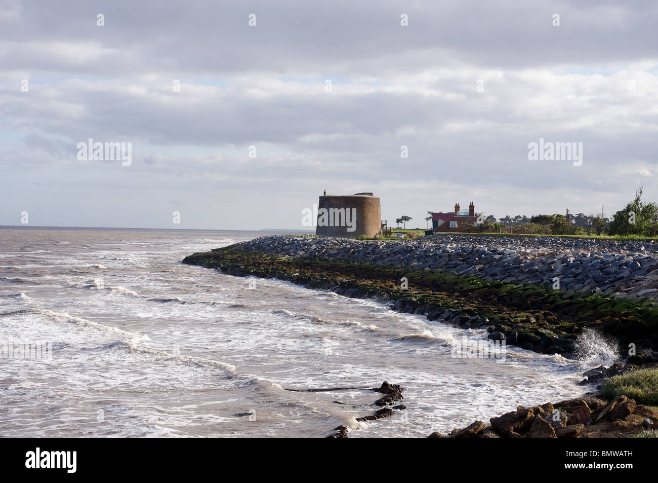 Martello tower protected from coastal erosion by rock armor Stock Photo ...