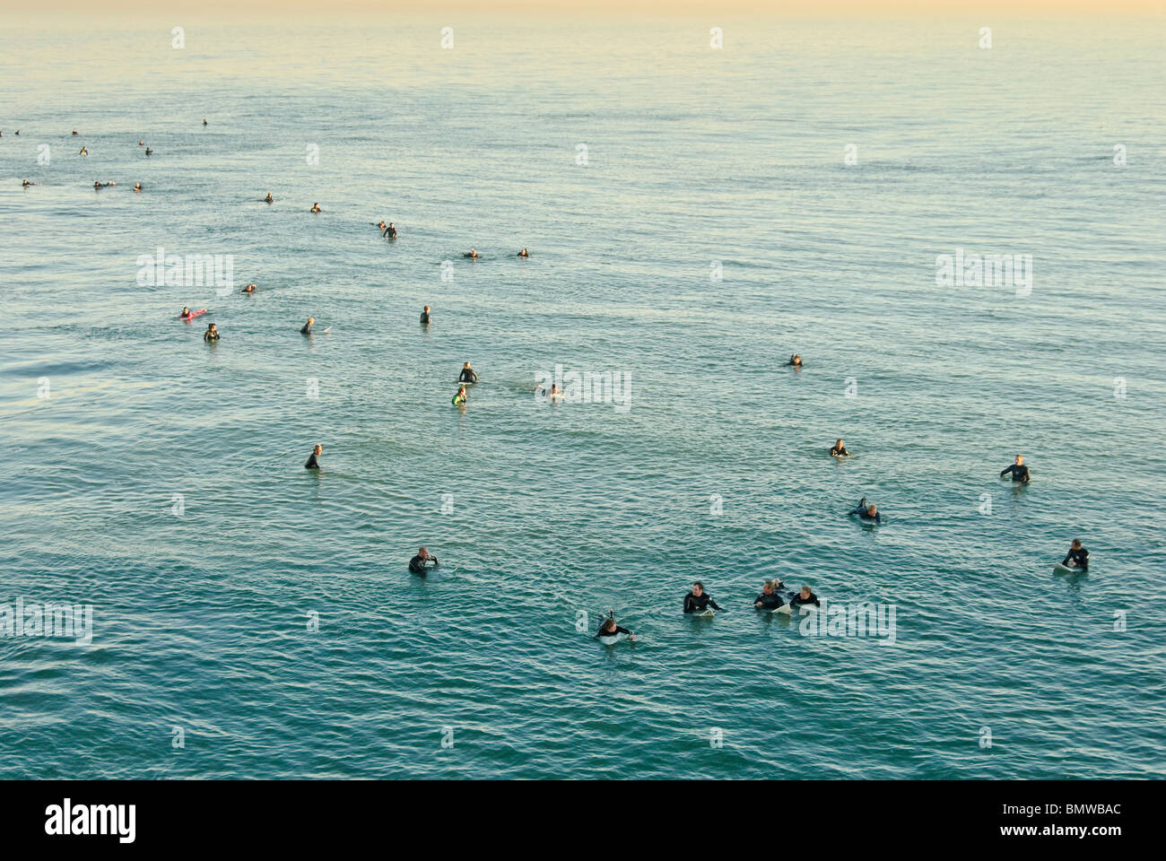 Large group of surfers gathered in Surf City, USA at Huntington Beach ...