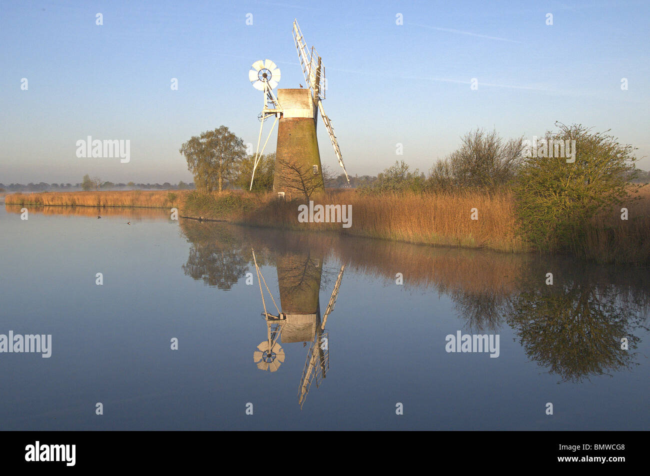 TURF FEN WIND PUMP AT DAWN AT HOW HILL ON THE RIVER ANT. NORFOLK BROADS ...