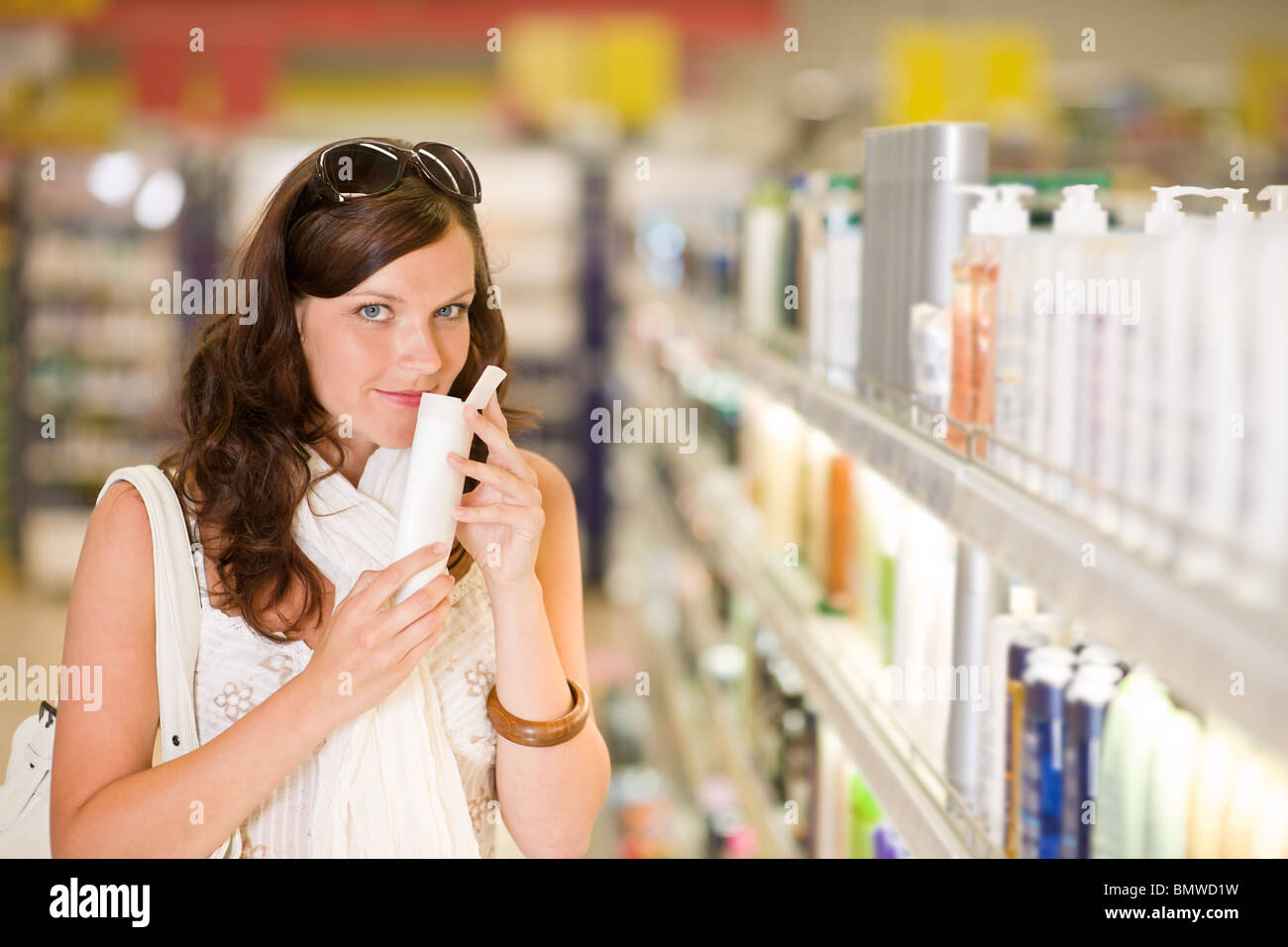 Supermarket woman smelling bottle hi-res stock photography and images ...