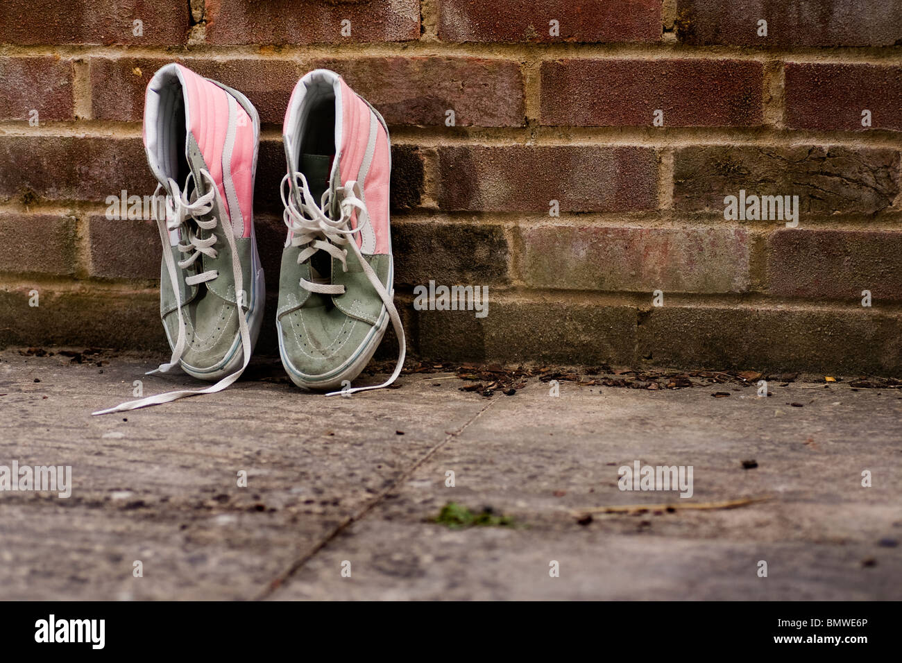 A pair of pin and grey retro trainers Stock Photo - Alamy