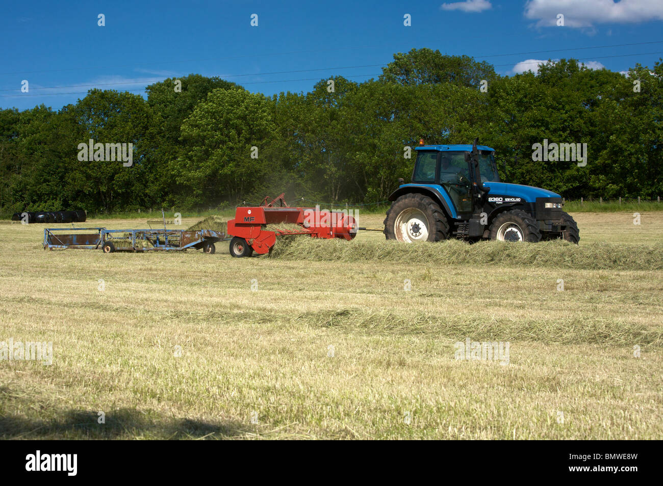 Tractor baling hay hi-res stock photography and images - Alamy