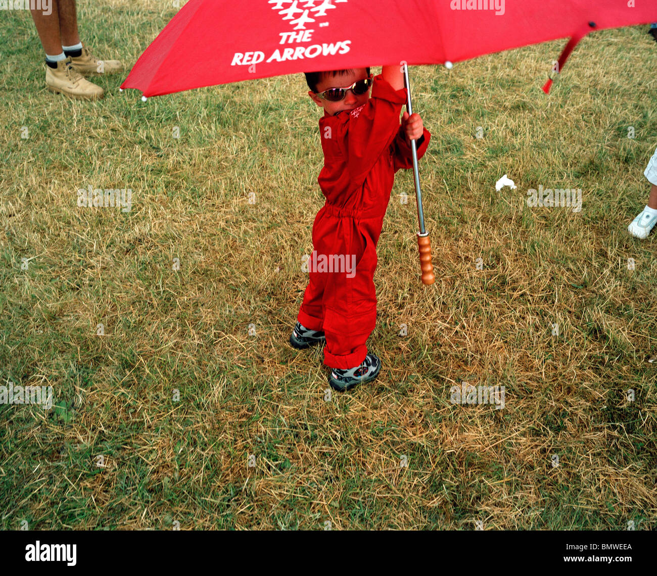 Young lad wears merchandising flight suit of the 'Red Arrows', Britain ...