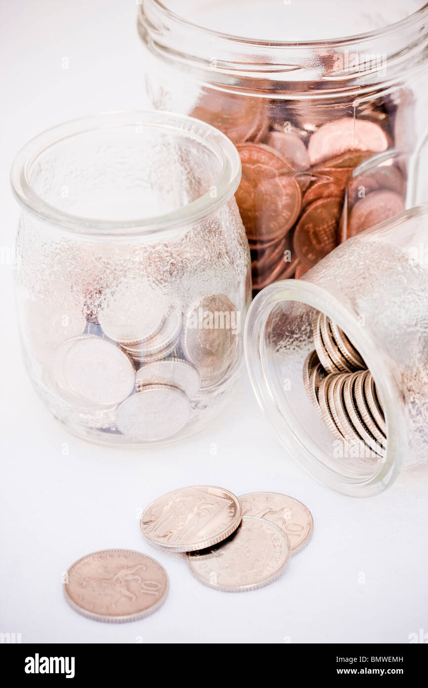 Coins in glass jars Stock Photo - Alamy
