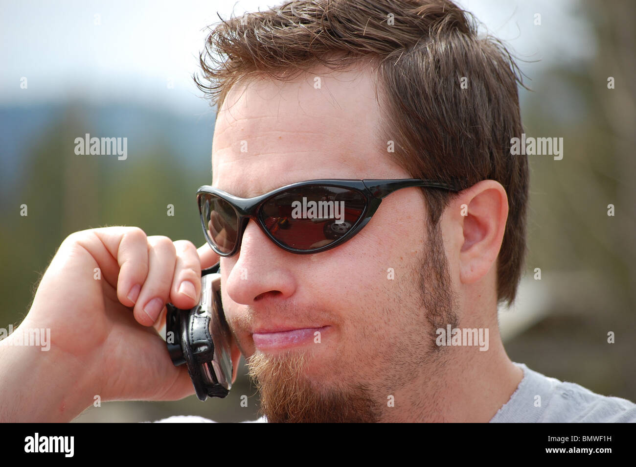 Man talking on cell phone Stock Photo - Alamy